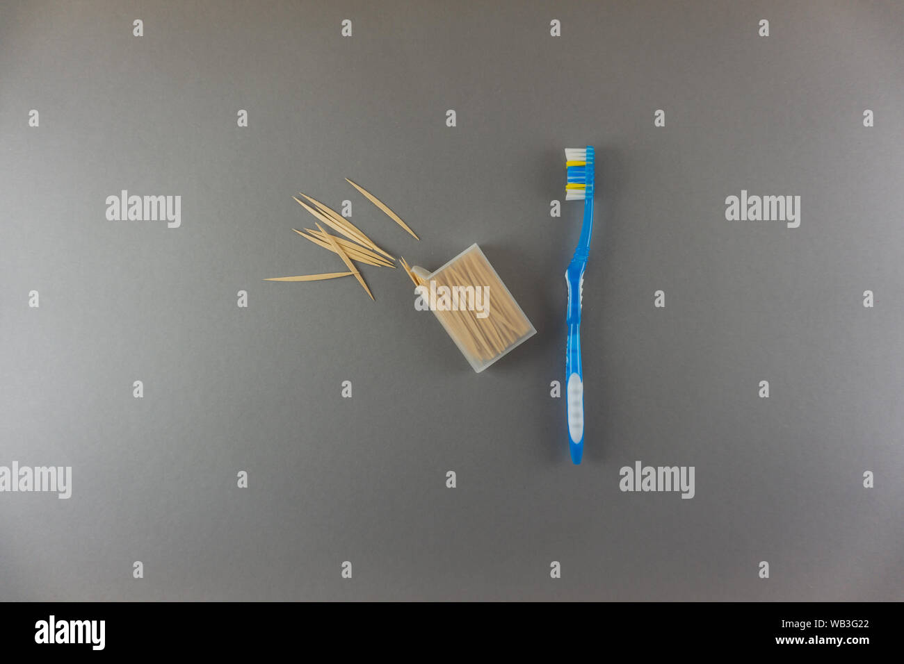 Messy arranged toothpicks with toothbrush on gray background Stock ...
