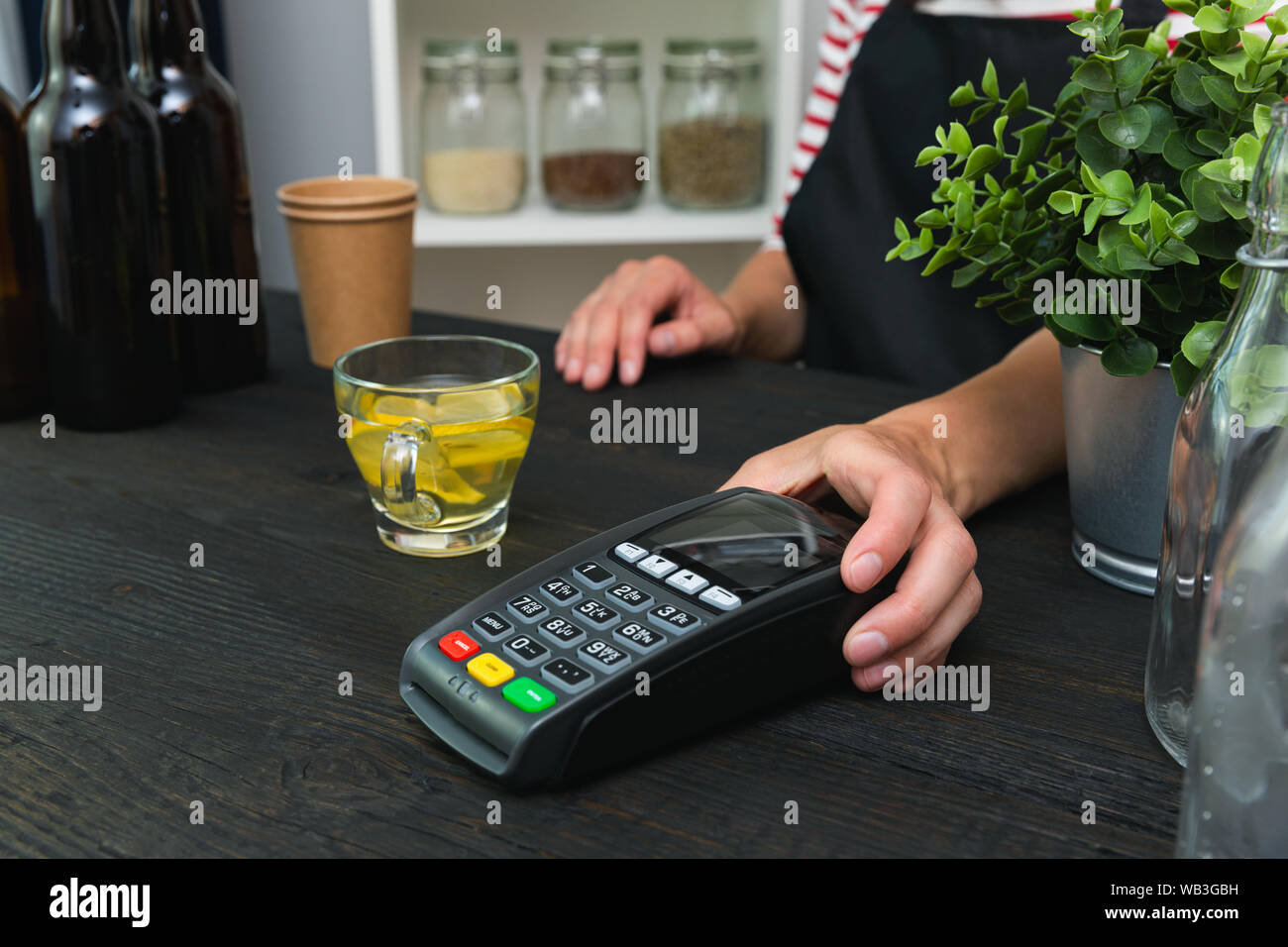 Store worker requesting for payment over nfc technology. Store worker ...