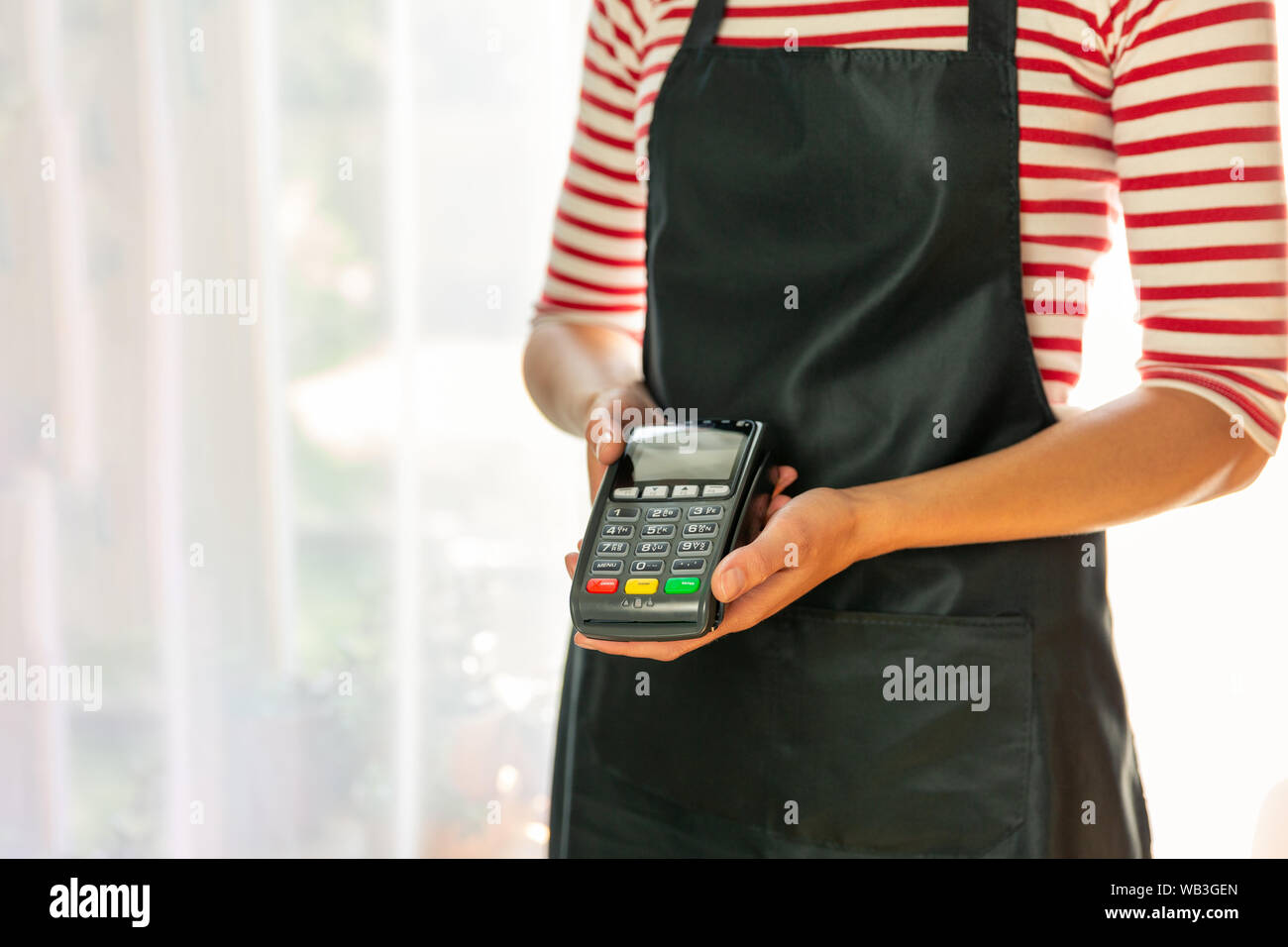 Store worker requesting for payment over nfc technology. Store worker ...