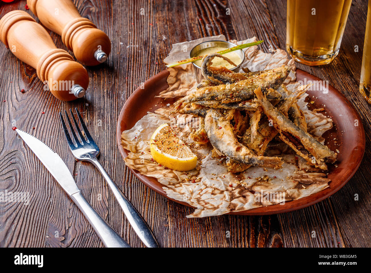 Set with seafood, small deep fried sea fish, food that is usually ...