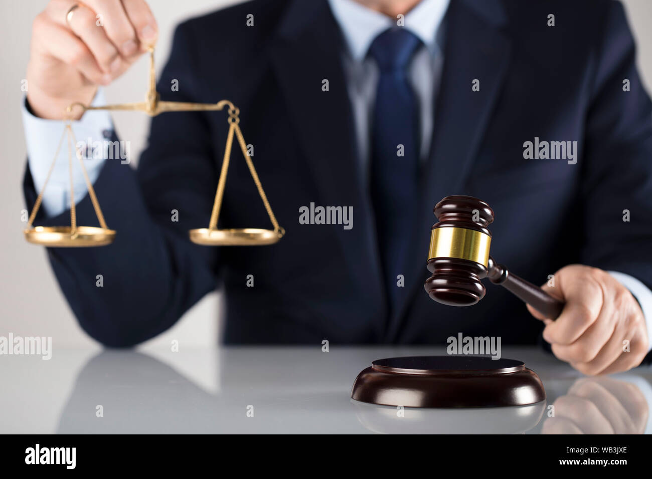 Attorney at law with antique wooden mallet. Legal counsel office. Place ...