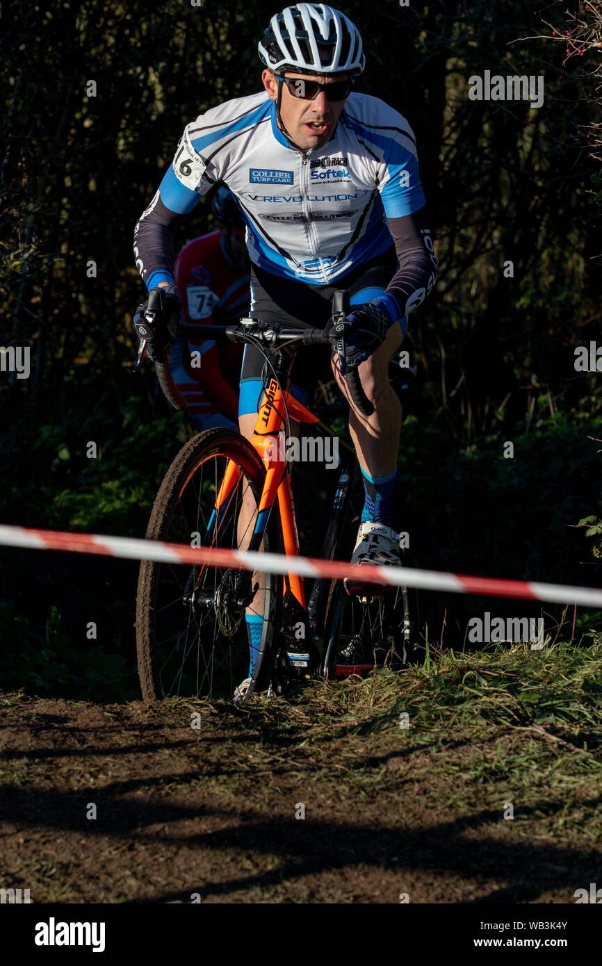 Cyclocross rider breasting a short sharp climb Stock Photo - Alamy