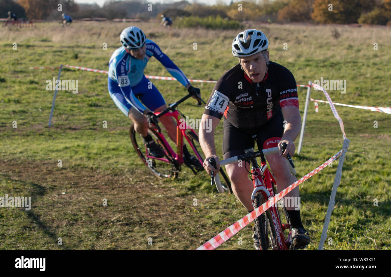 Two cyclocross riders take a fast right hander Stock Photo - Alamy