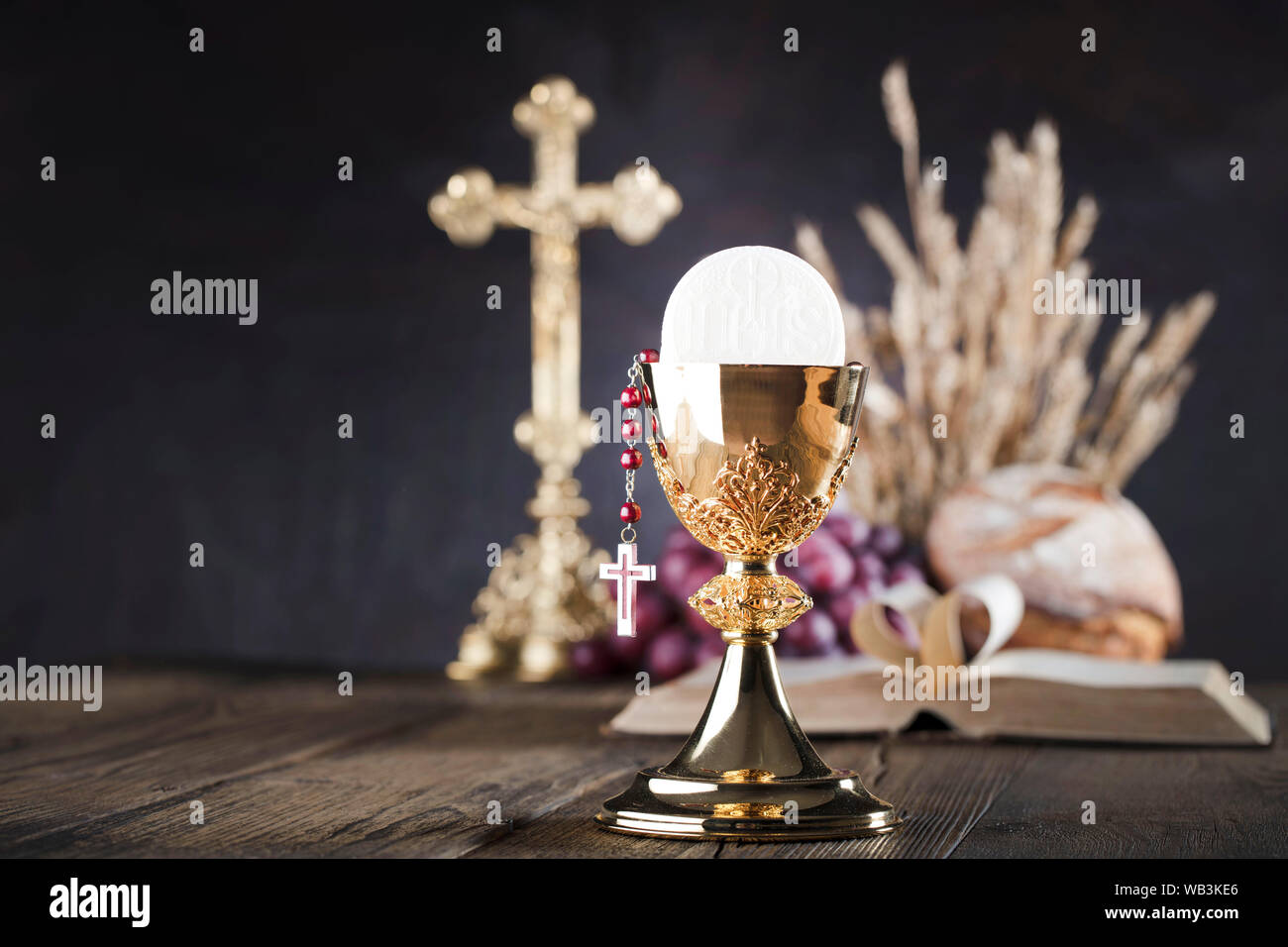Catholic concept background. The Cross, Holy Bible and golden chalice ...