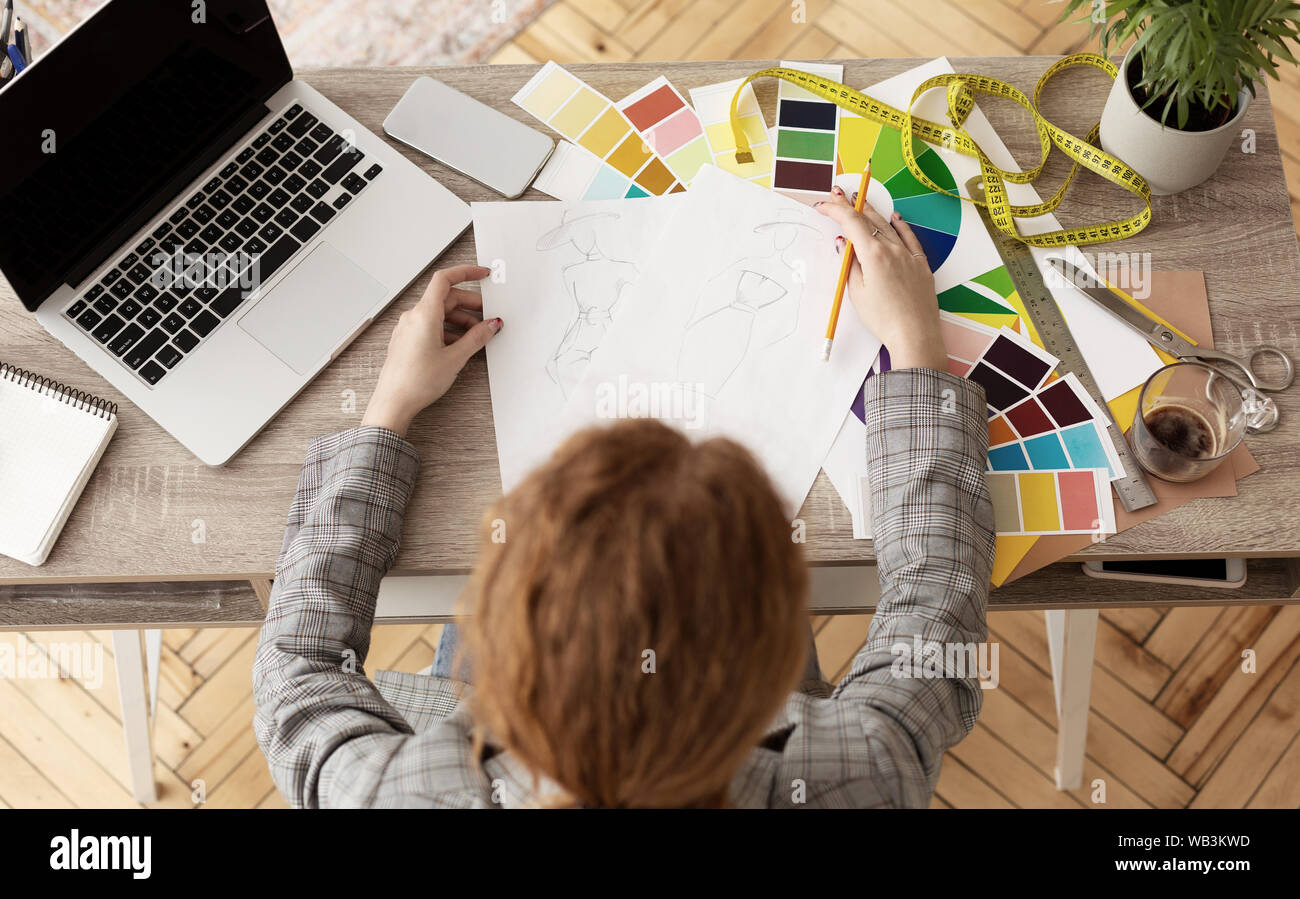Talented tailor designing new collection, drawing sketches Stock Photo ...