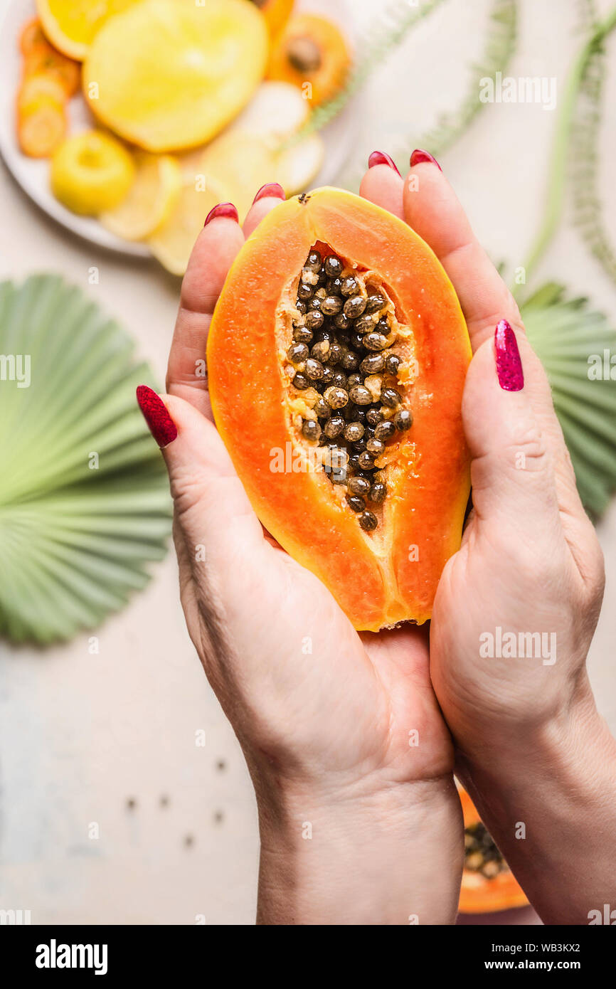 Close up woman hand holding papaya hi-res stock photography and images ...