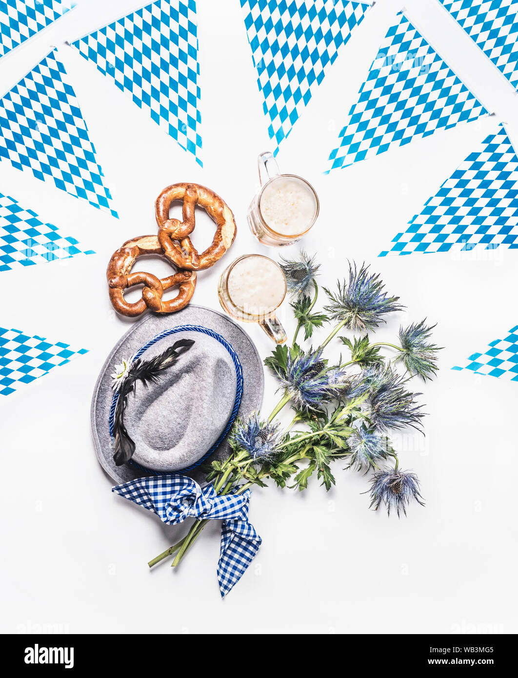 Oktoberfest layout with traditional Bavarian white blue fabric, pretzel ...