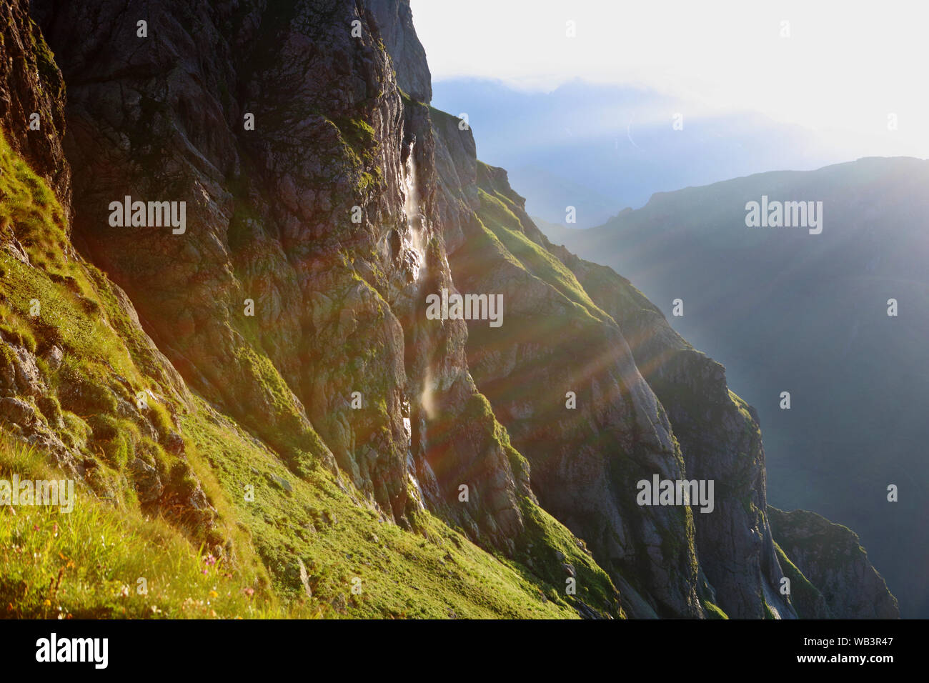 Waterfall lit by morning sun Stock Photo - Alamy