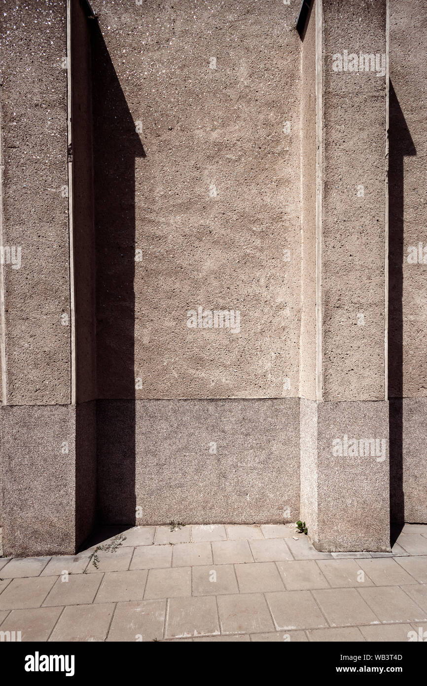 Old weathered street wall with two columns Stock Photo - Alamy