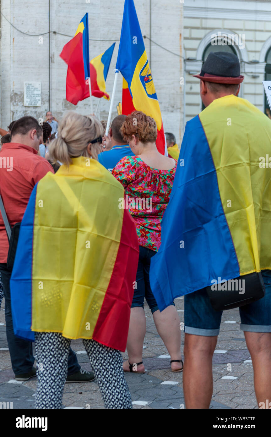 TIMISOARA, ROMANIA - AUGUST 10, 2018: Protesters covered with the ...