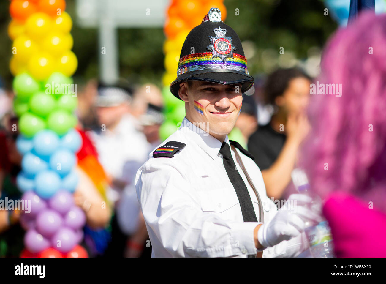 Cardiff, Wales, UK, August 24th 2019. A policeman wearing rainbows ...