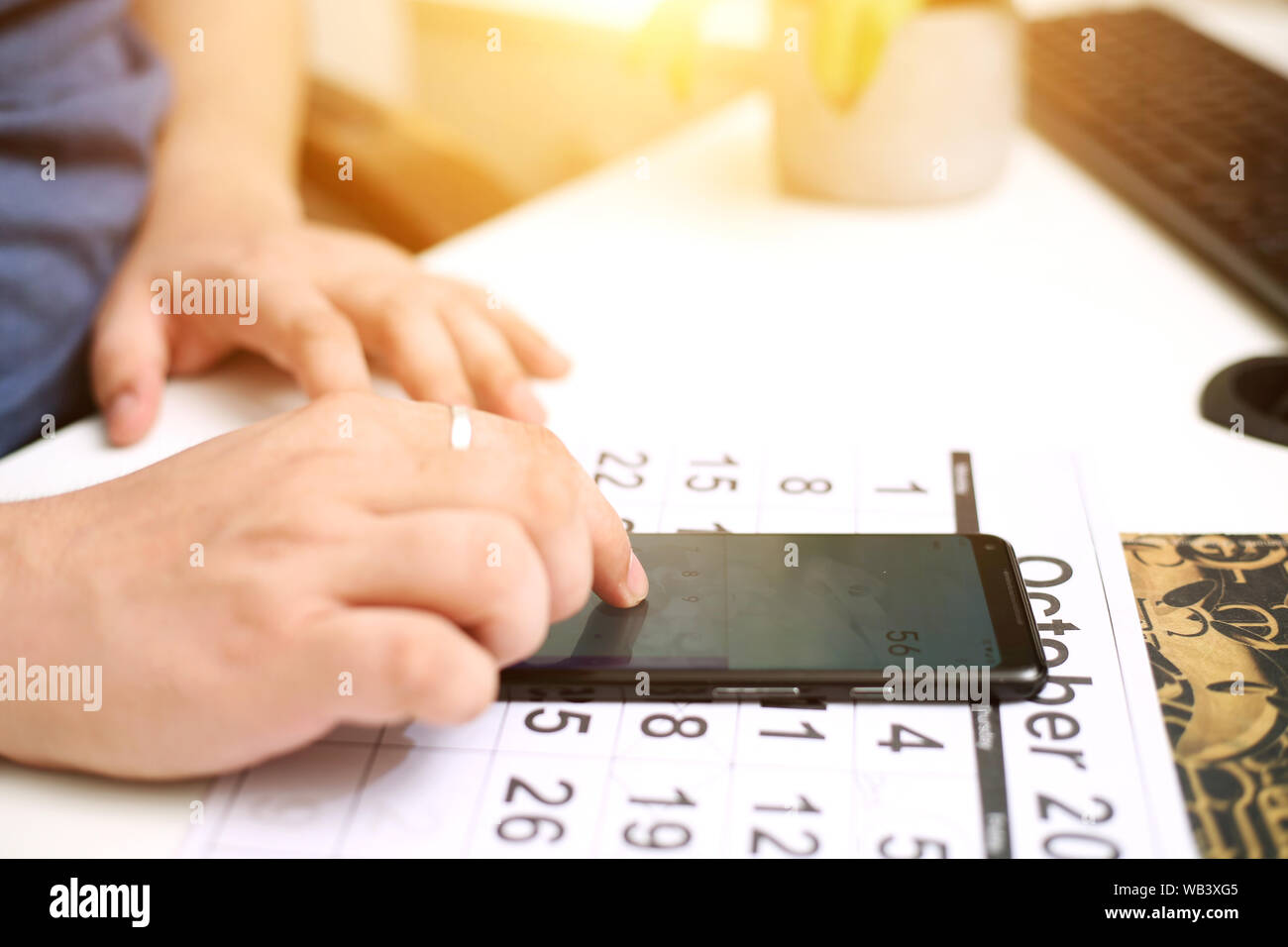 Picture of Man holding Calendar and marking on a date. Isolated on ...