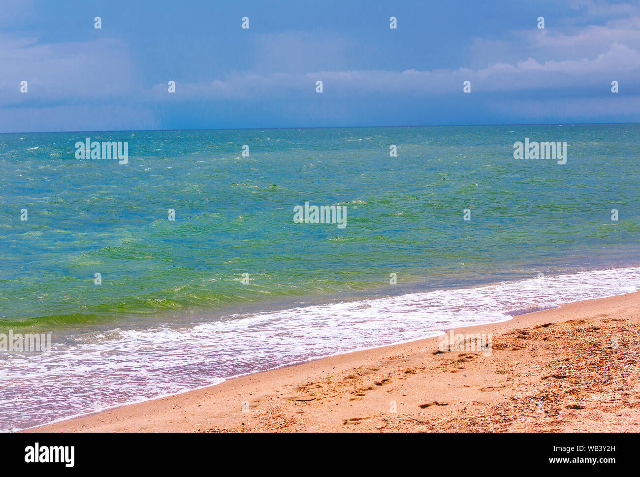sea waves and empty sandy beach Stock Photo - Alamy