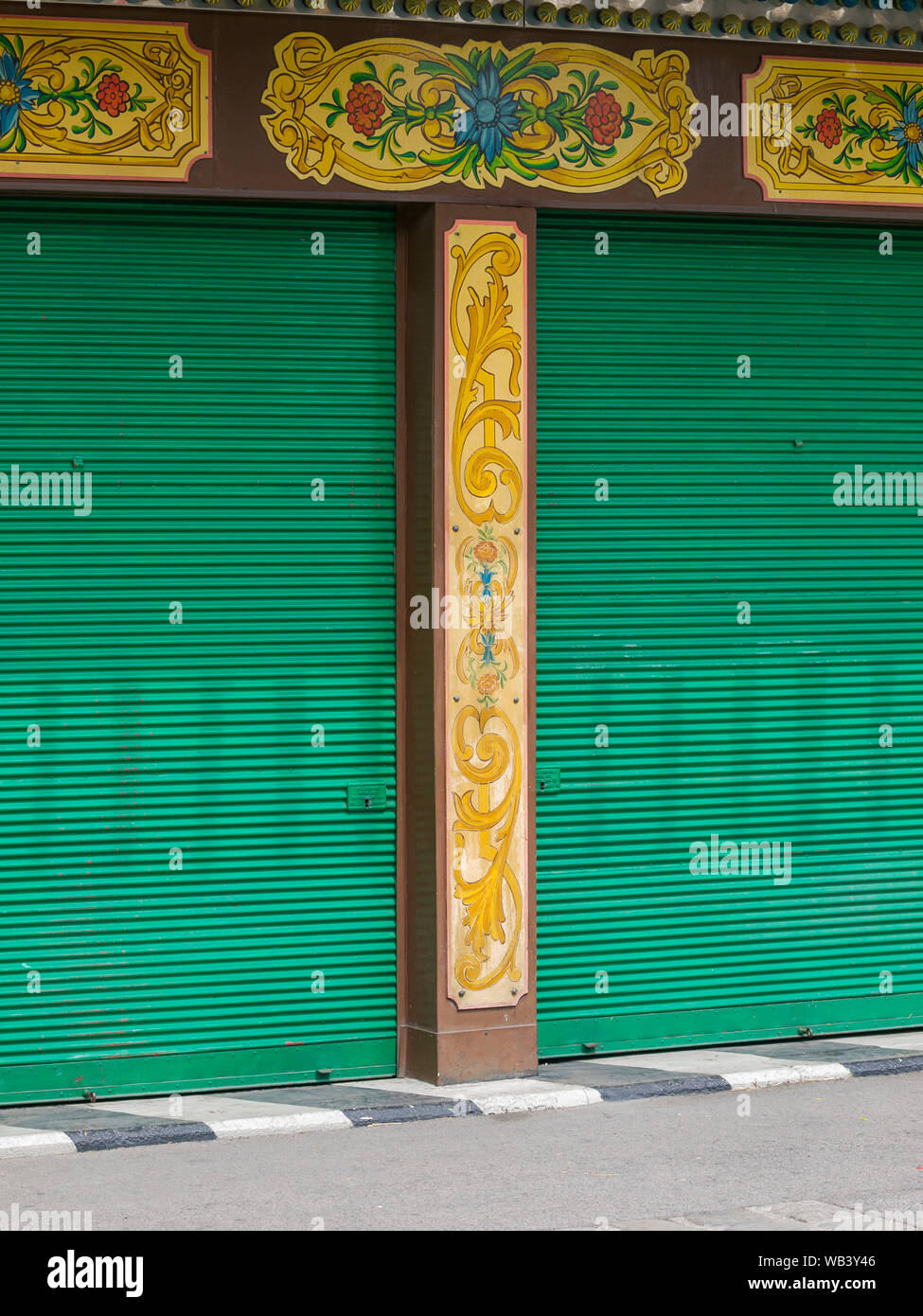 closed booth stand a with green roller shutter door and nostalgic ...