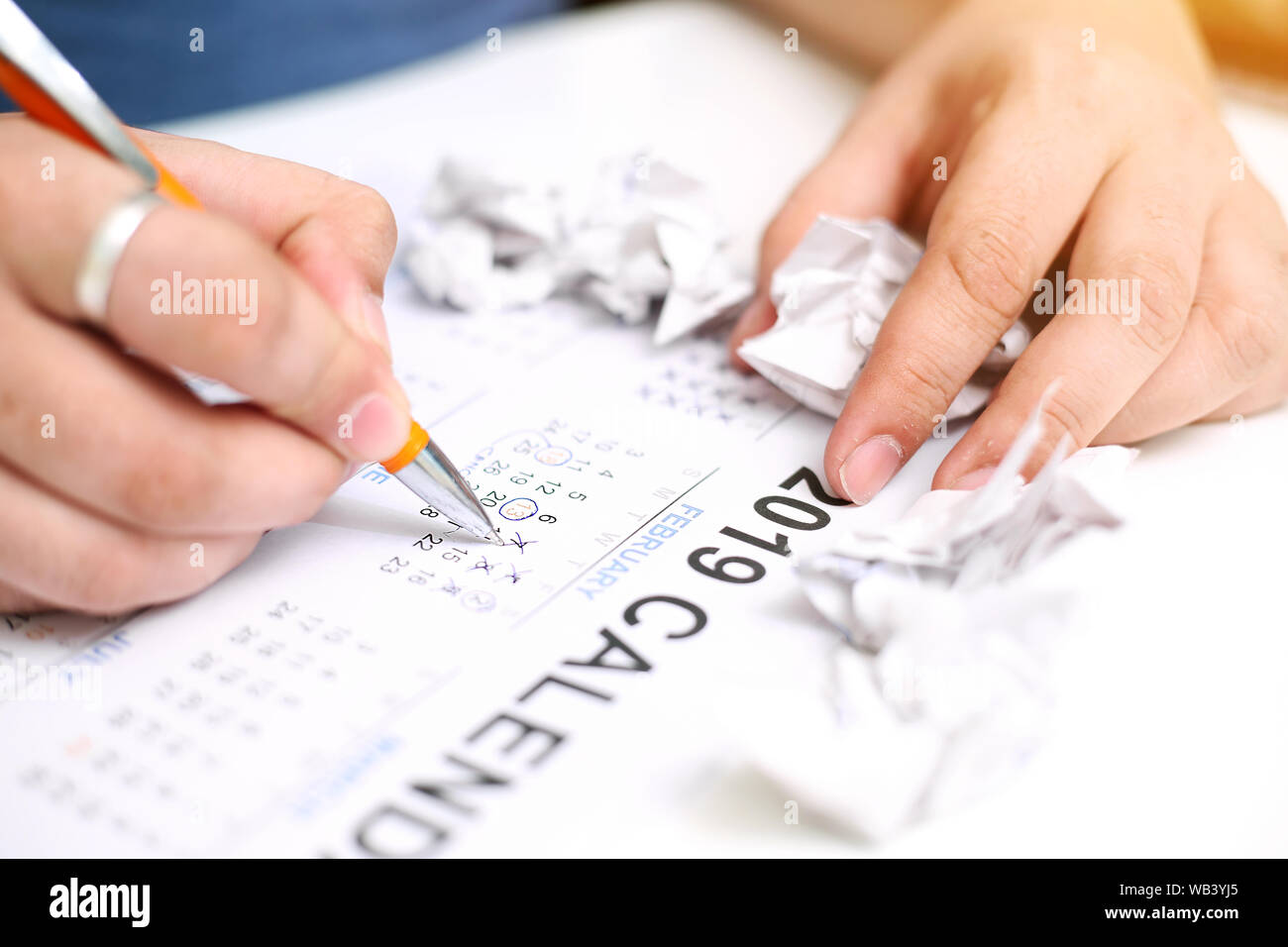 Picture of Man holding Calendar and marking on a date. Isolated on ...