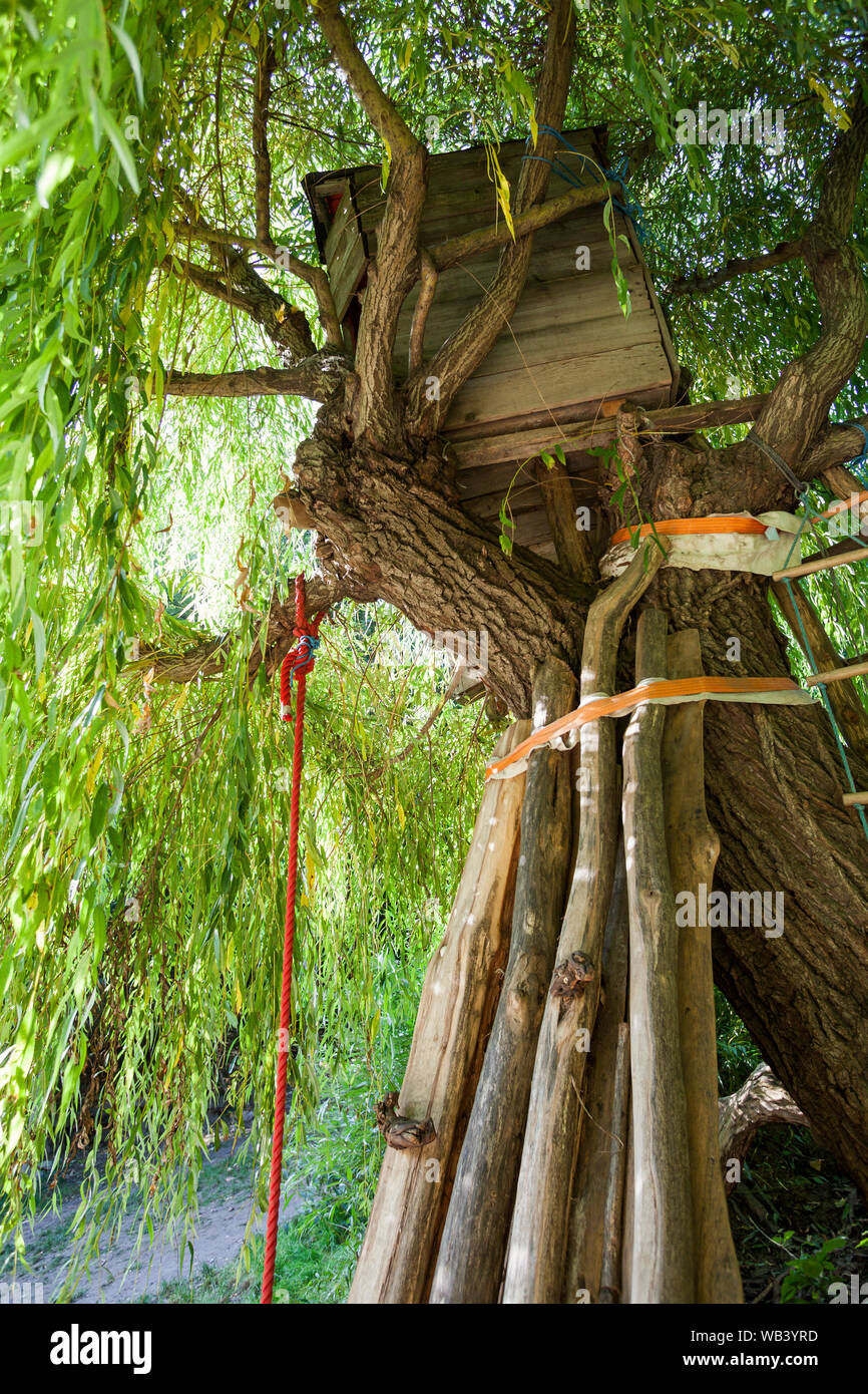 self made wooden treehouse for kids Stock Photo - Alamy