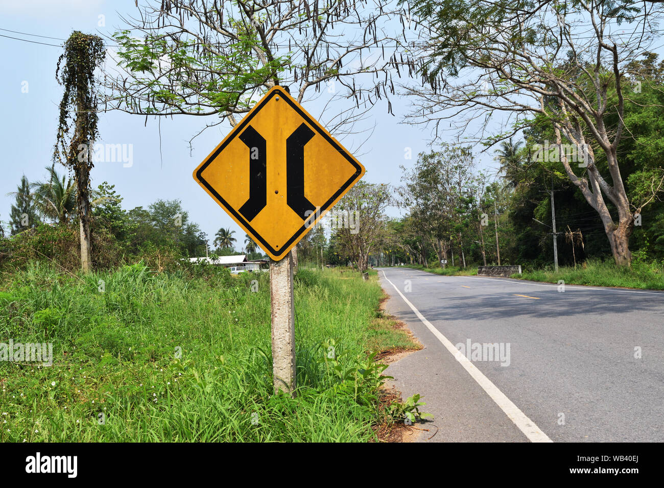 Approaching narrow bridge sign on roadside in Thailand Stock Photo - Alamy