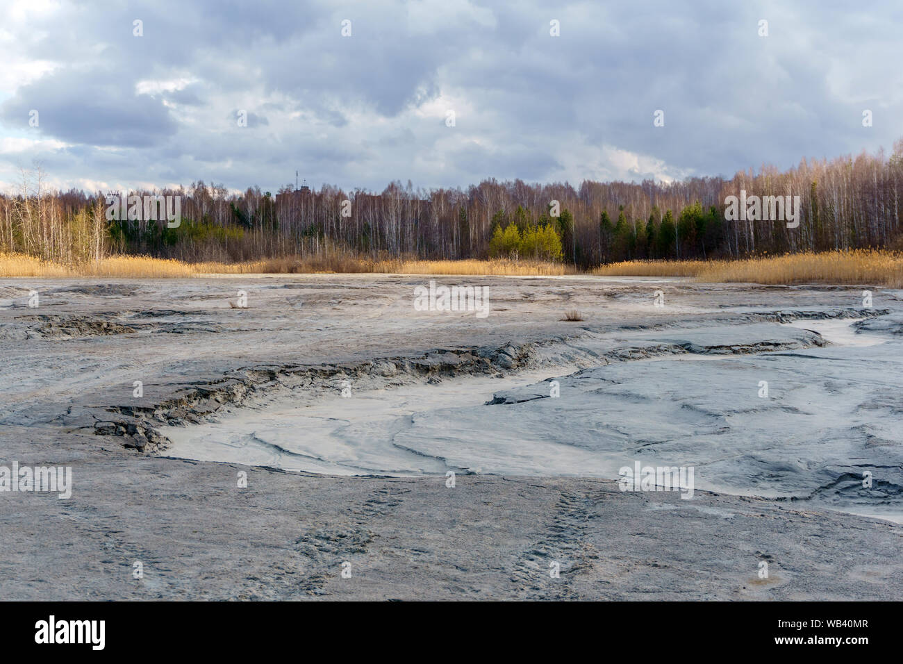 muddy bottom of a dried lake in the background of the landscape in ...