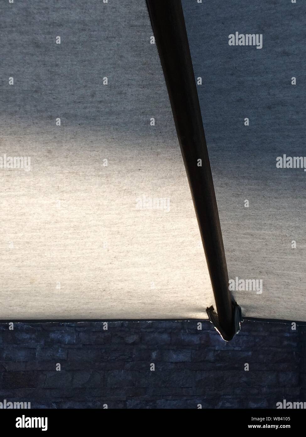 Vertical closeup shot of a metal bar attached to a wall Stock Photo - Alamy