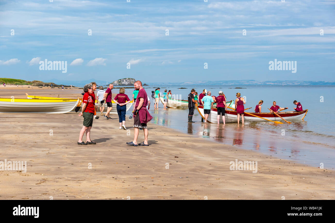 North Berwick, Scotland, UK, 24 August 2019. Colourful rowing skiffs ...