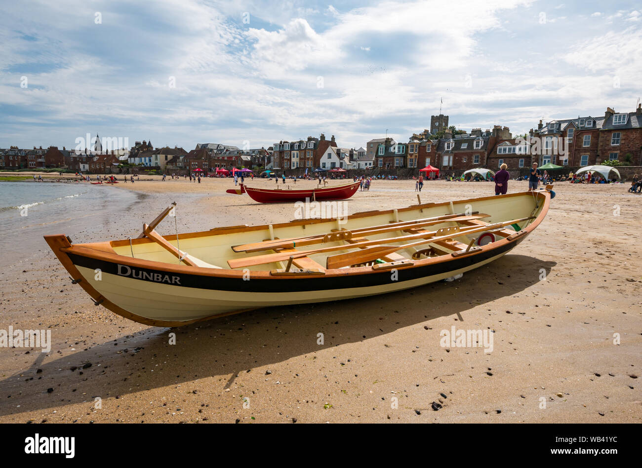 North Berwick, Scotland, UK, 24 August 2019. Colourful rowing skiffs taking part in the regatta ...