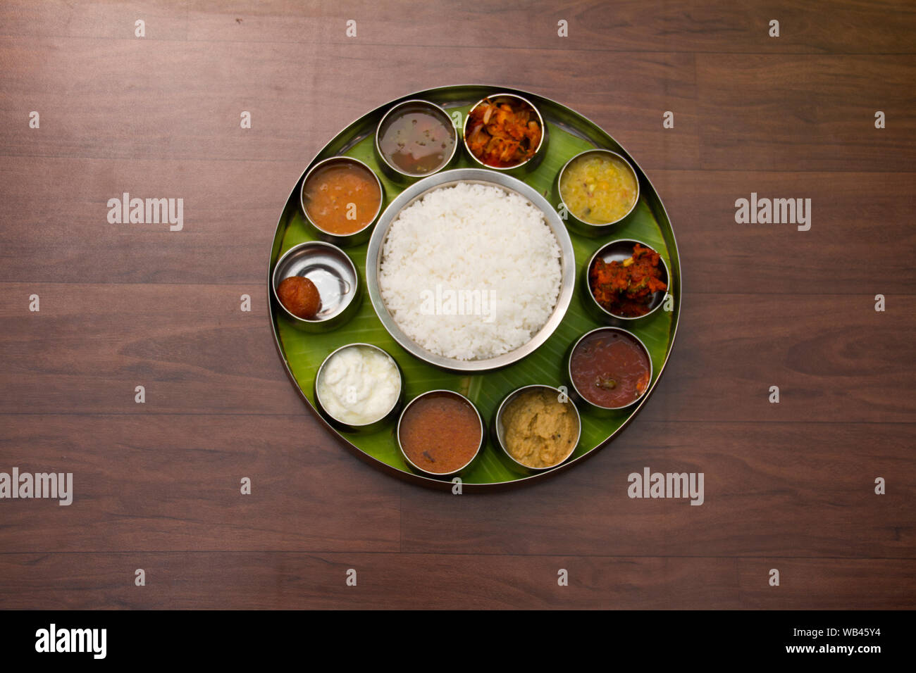 Hot veg full Meal of plate with wood table Stock Photo - Alamy