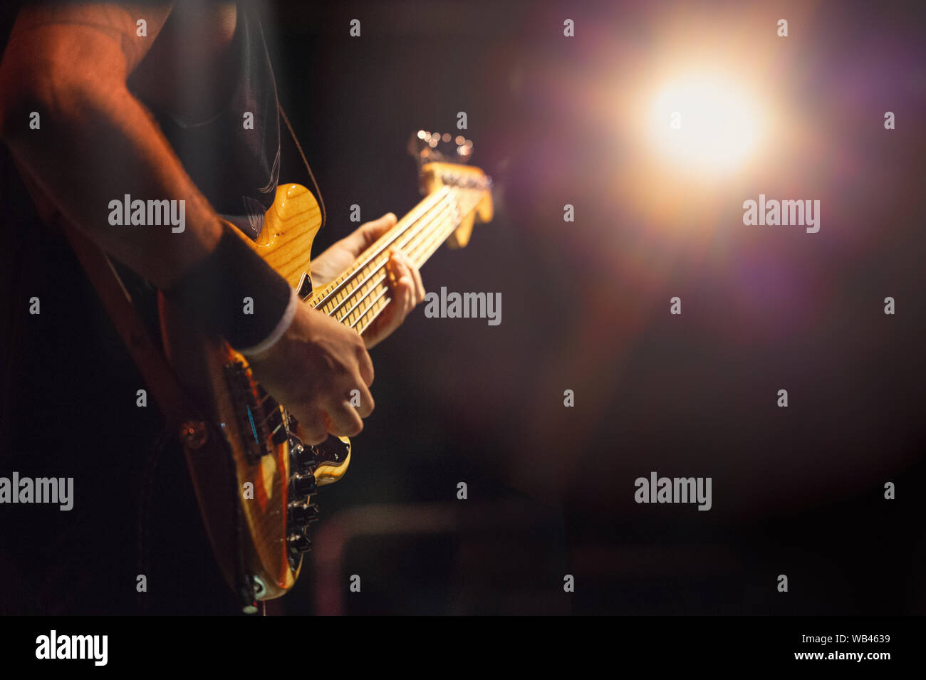 5-string bass player during a live show Stock Photo - Alamy