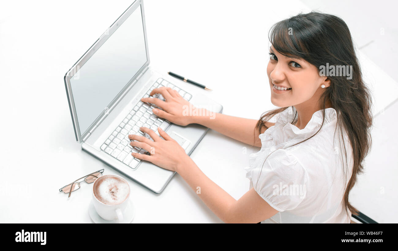 closeup.young woman working on laptop. the view from the top.isolated ...
