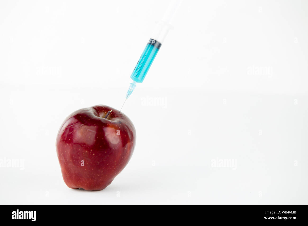 Concept: human GMO manipulation of nature and relative poisoned fruits ...