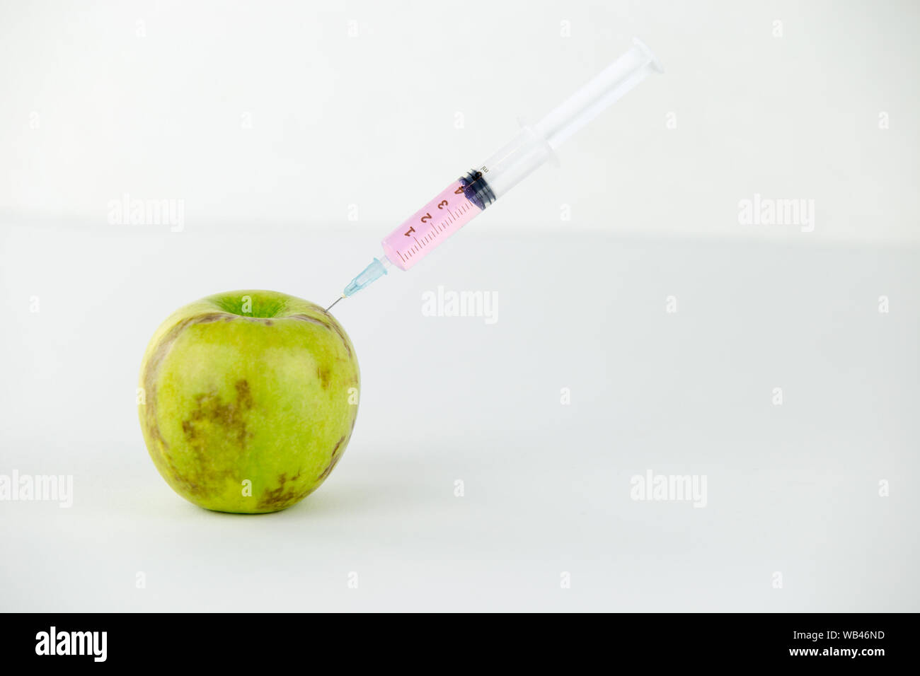 Concept: human GMO manipulation of nature and relative poisoned fruits ...