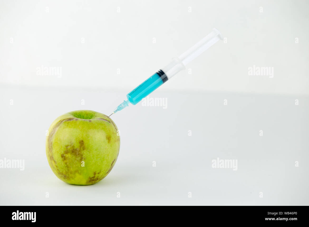 Concept: human GMO manipulation of nature and relative poisoned fruits ...