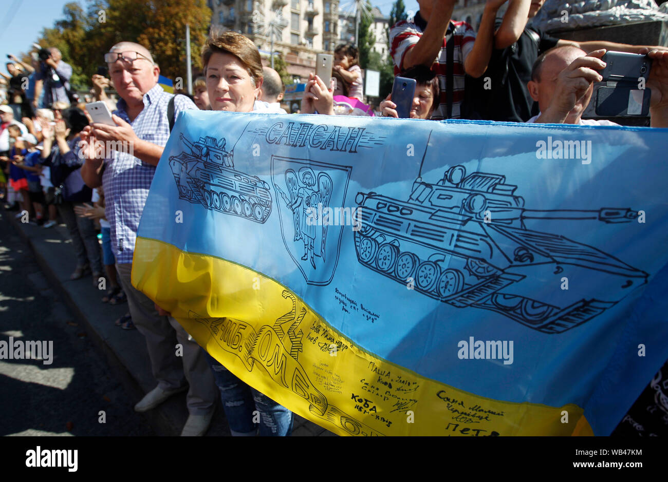 People hold a Ukrainian flag at the Independence Square during the ...