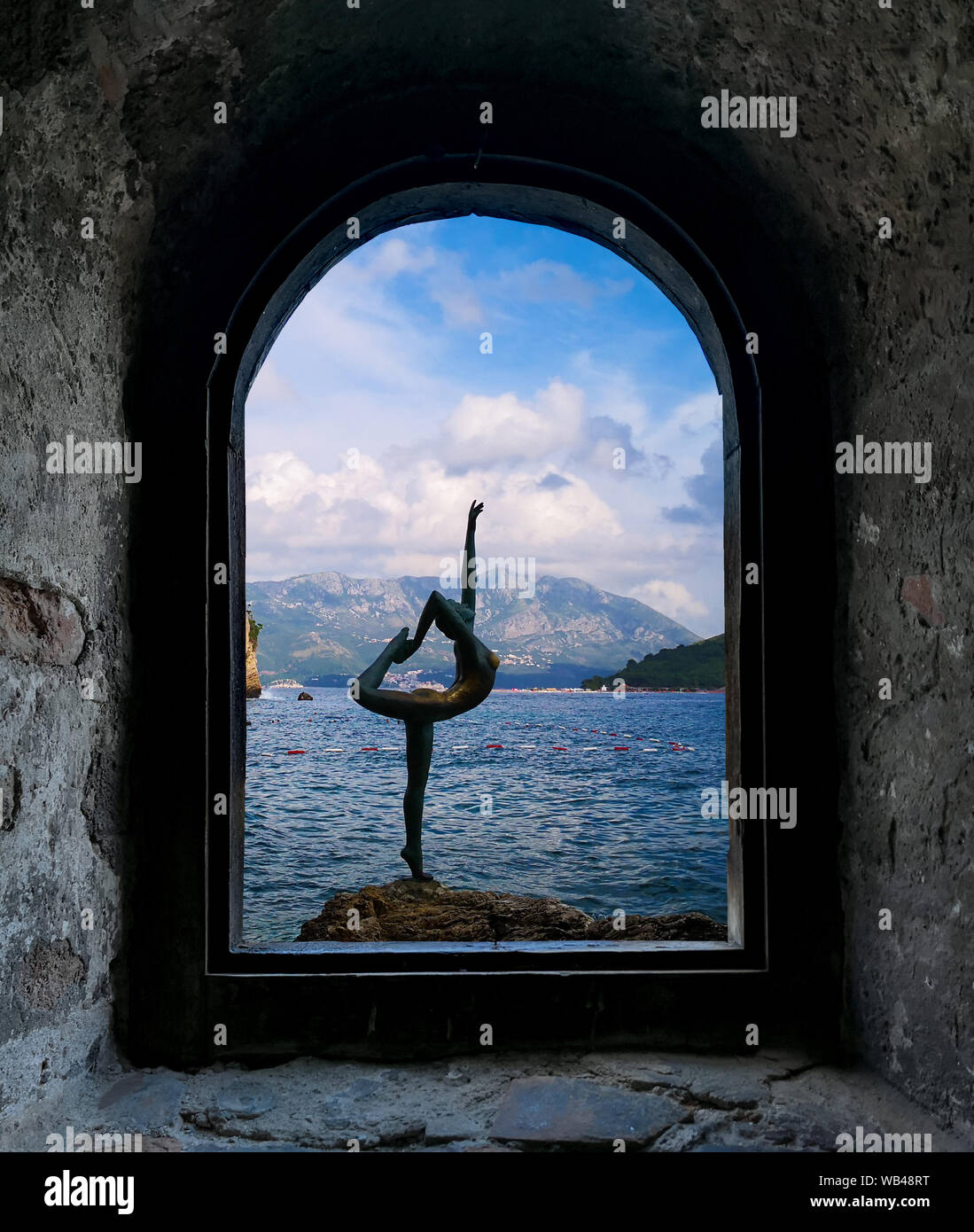 From the rock window: Statue of a ballerina Dancer of Budva against the ...