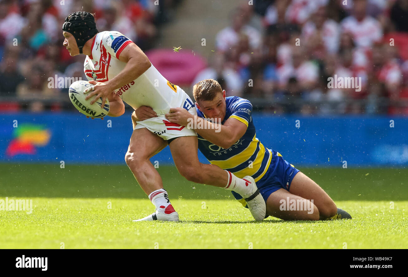 St Helens' Jonny Lomax and Warrington's Declan Patton during the Coral ...