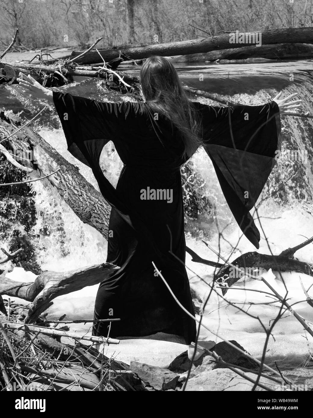 Young witch in long Black and White Stock Photos & Images - Alamy