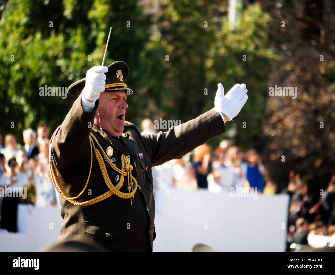 The military conductor directs the orchestra. The Procession of Dignity ...