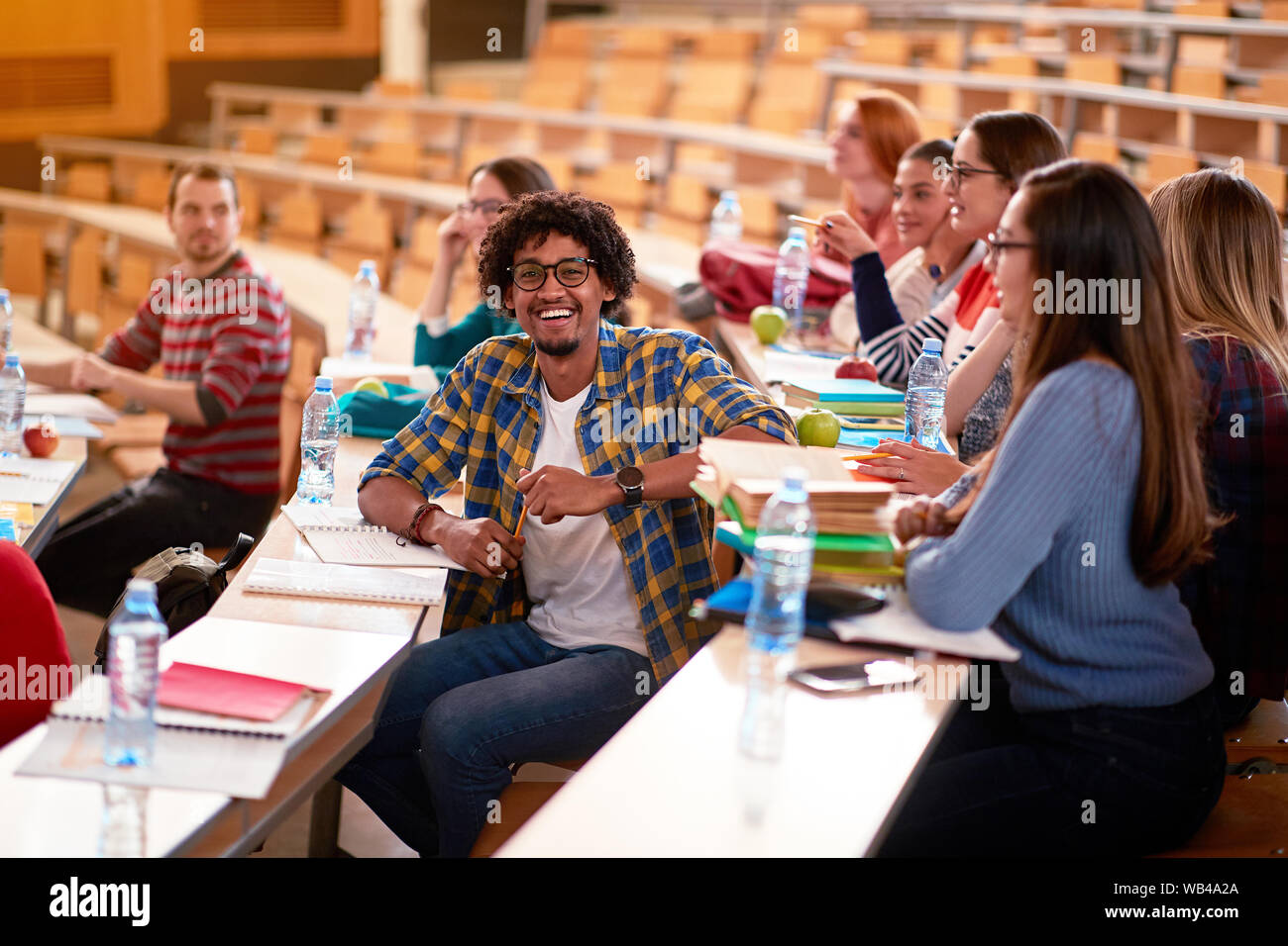 Smiling Multiracial young students studying together Stock Photo - Alamy