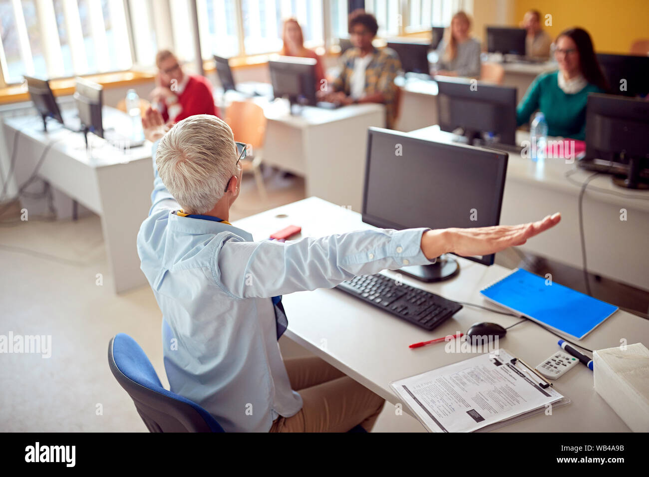 Teacher explaining something hi-res stock photography and images - Alamy