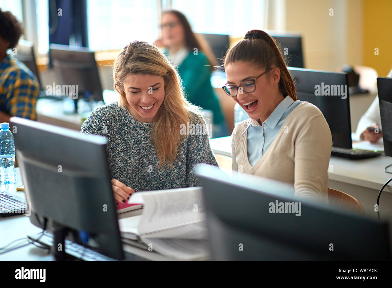 IT workshop at university. Happy Girl on class with computer on ...
