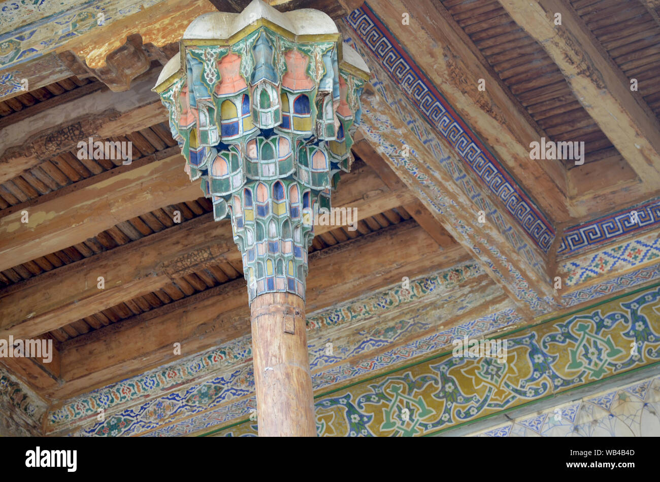 Ornated wooden columns and ceiling of Bolo Haouz Mosque in Bukhara ...