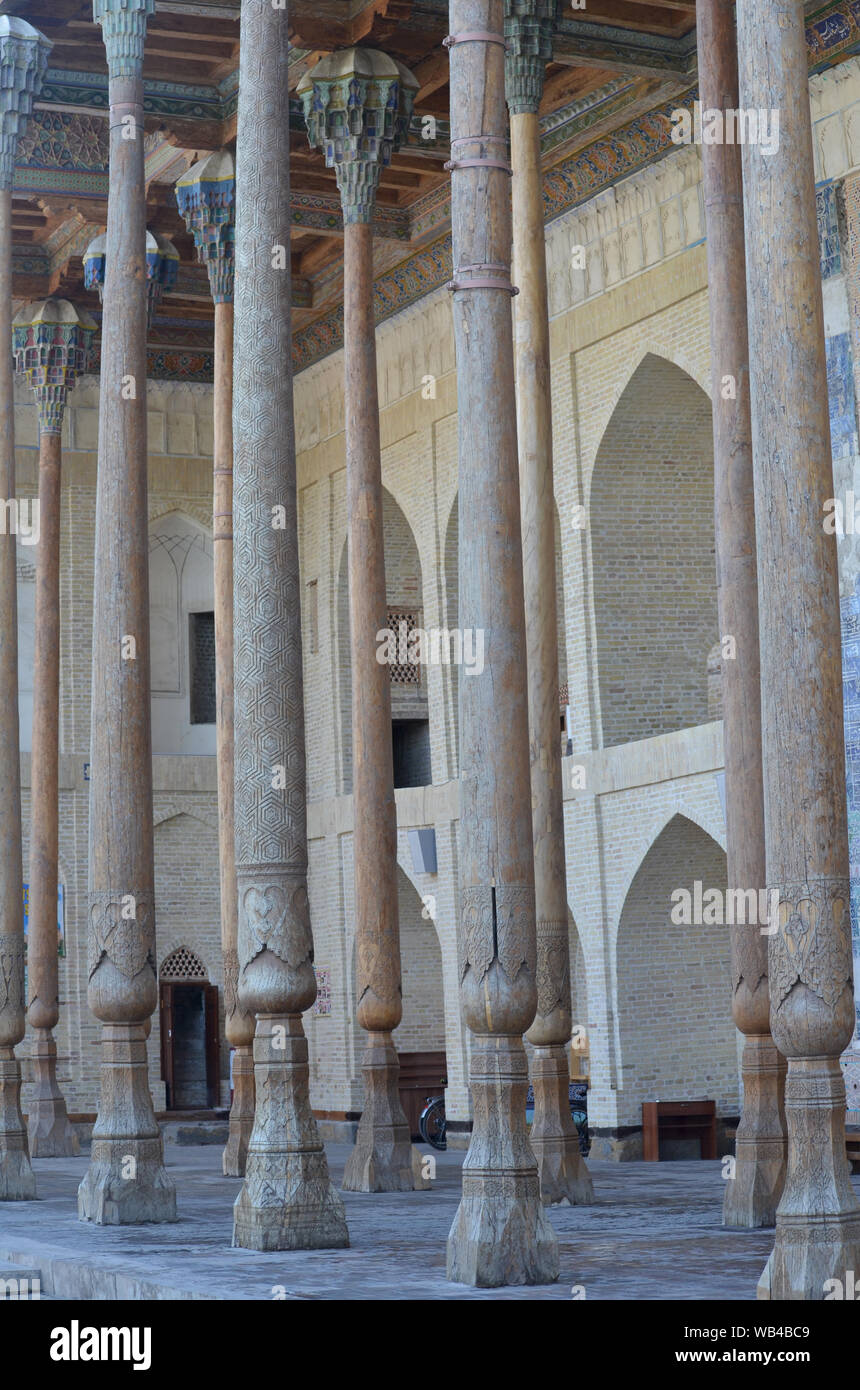Ornated wooden columns and ceiling of Bolo Haouz Mosque in Bukhara ...