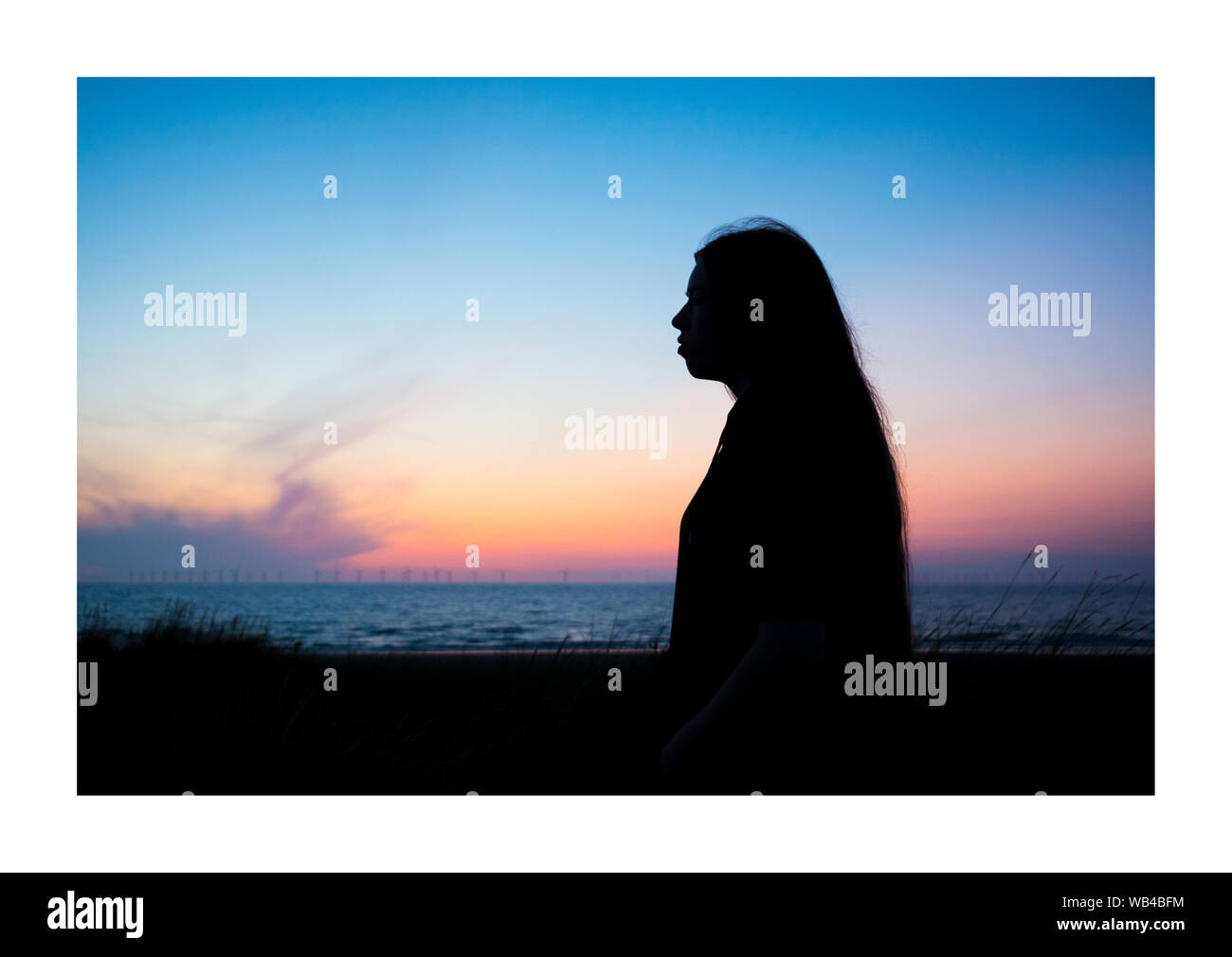 Silhouette of a girl at sunset hi-res stock photography and images - Alamy