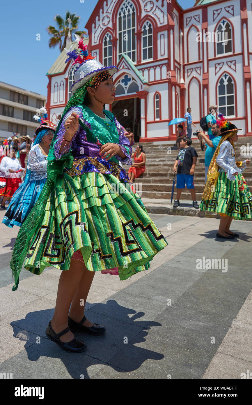 Members of a Waca Waca dance group in ornate costume performing at the ...