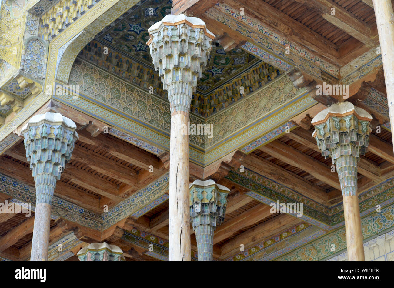 Ornated wooden columns and ceiling of Bolo Haouz Mosque in Bukhara ...