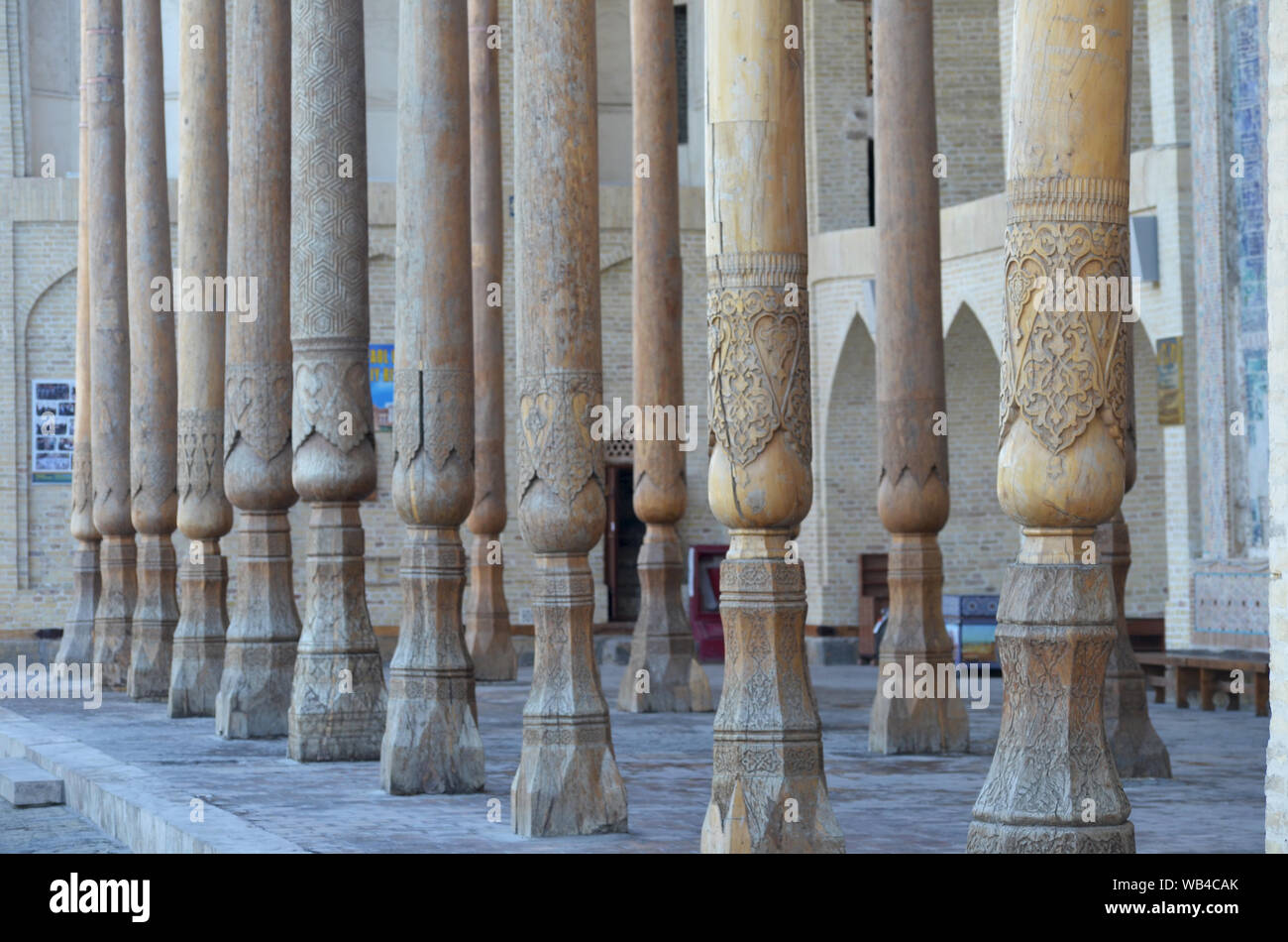 Ornated wooden columns and ceiling of Bolo Haouz Mosque in Bukhara ...