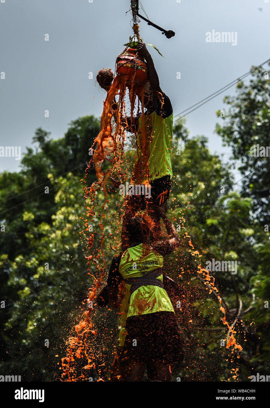 Mumbai, India. 24th Aug, 2019. A man stands on top of a human pyramid ...