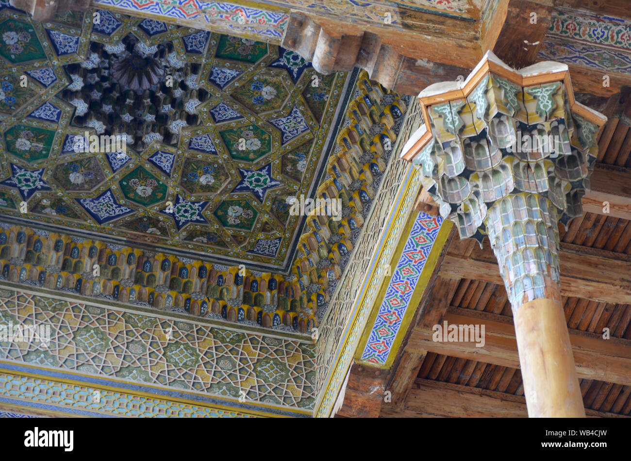 Ornated wooden columns and ceiling of Bolo Haouz Mosque in Bukhara ...