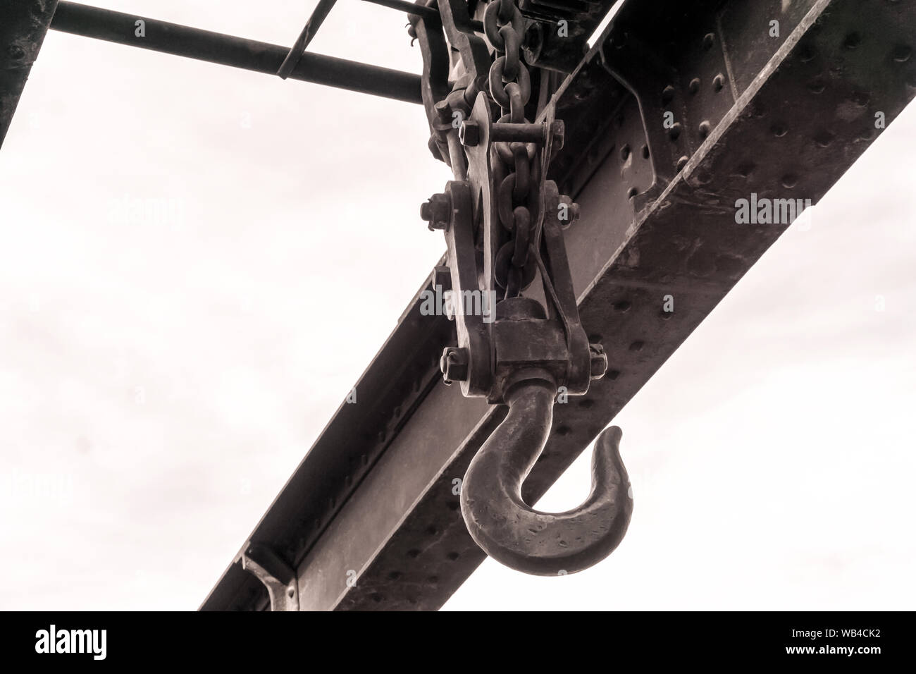 hook of an old steam-powered overhead crane against the light sky Stock ...