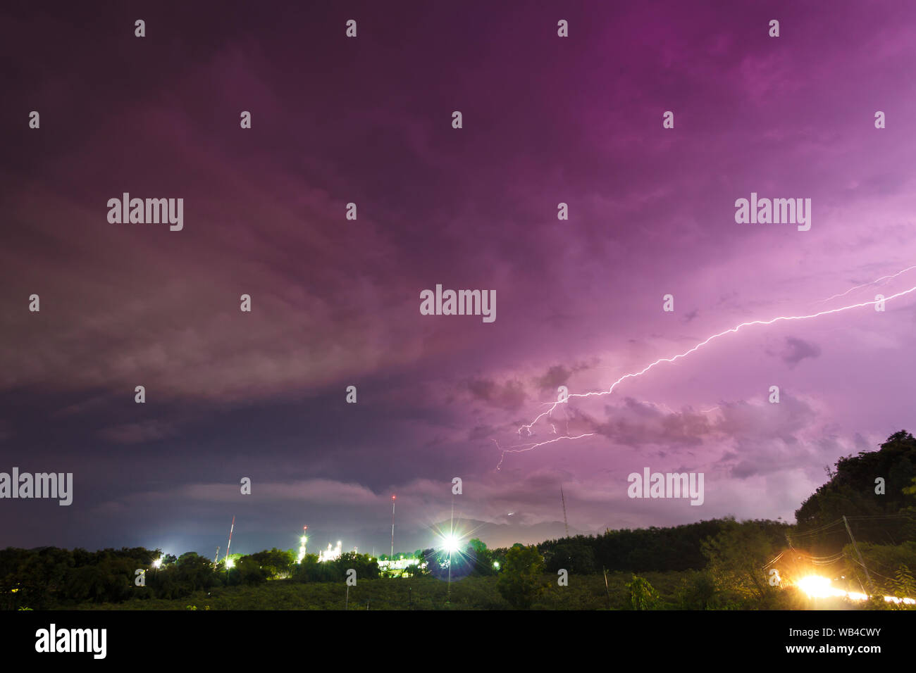 Storm and bright lightning strike at dusk at night Stock Photo - Alamy