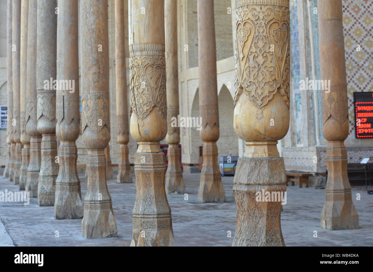 Ornated wooden columns and ceiling of Bolo Haouz Mosque in Bukhara ...